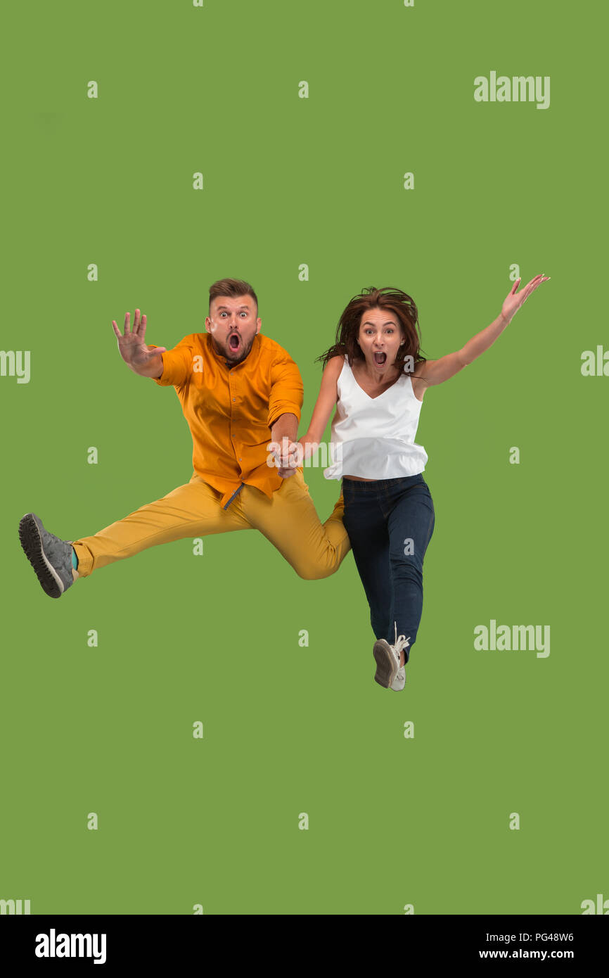 Freedom in moving and forward motion. The happy surprised young couple ...