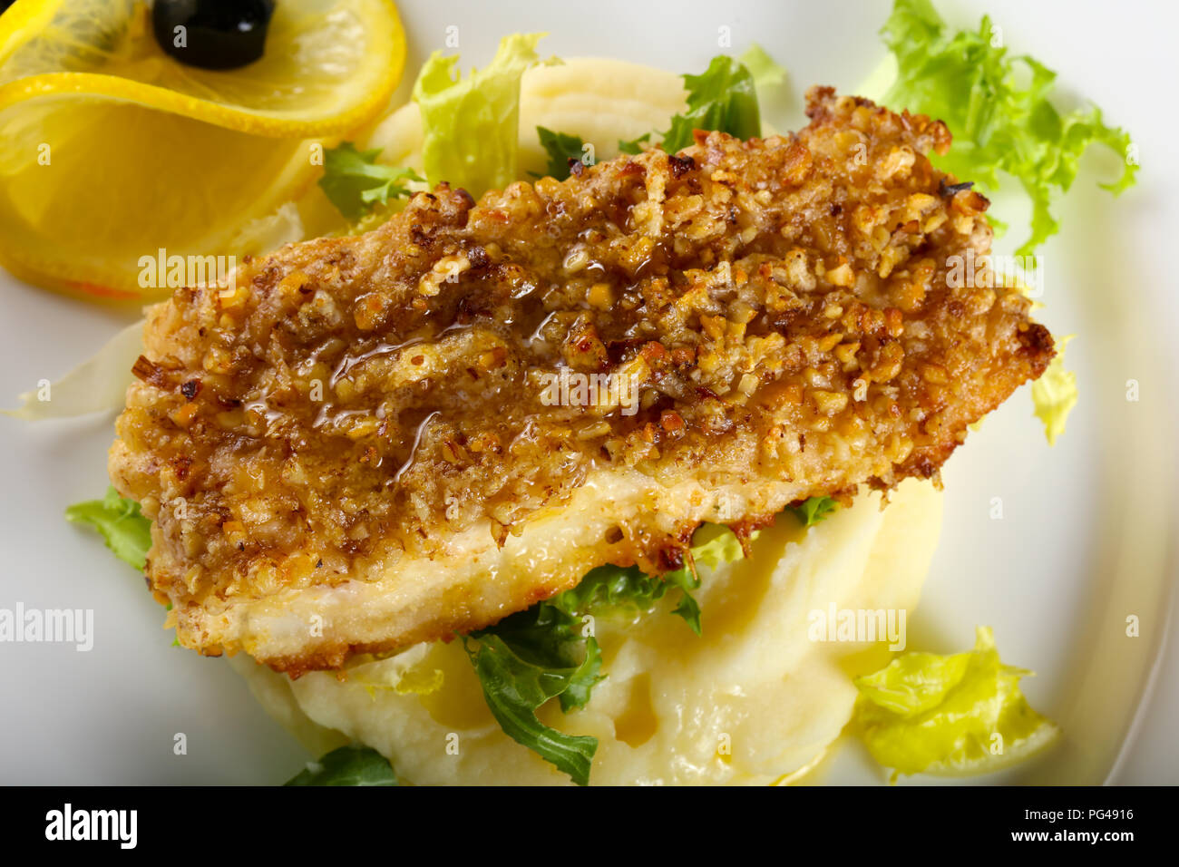 Baked Cod fish with mashed potato Stock Photo - Alamy