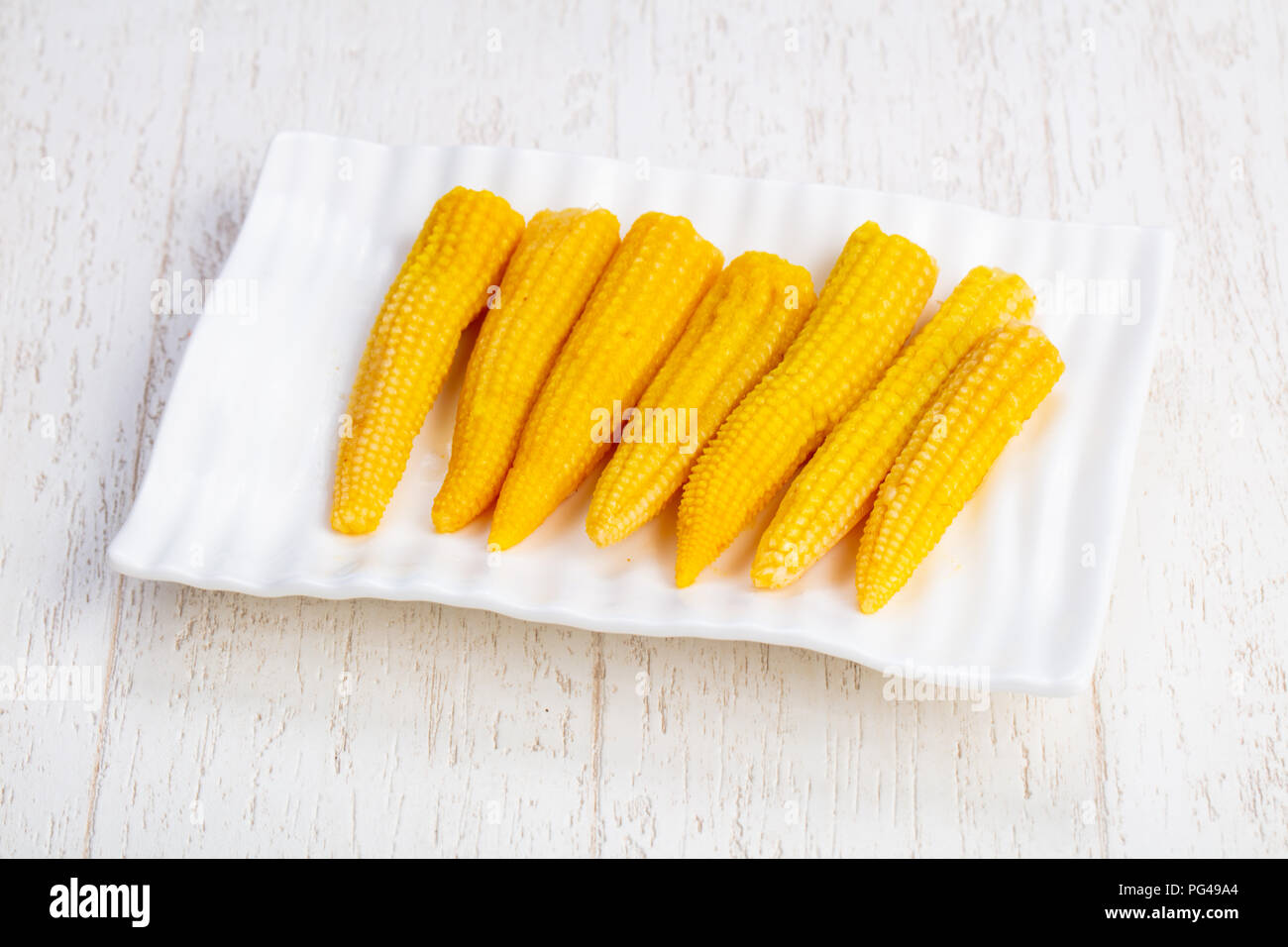 Tasty salty small pickled corn Stock Photo - Alamy