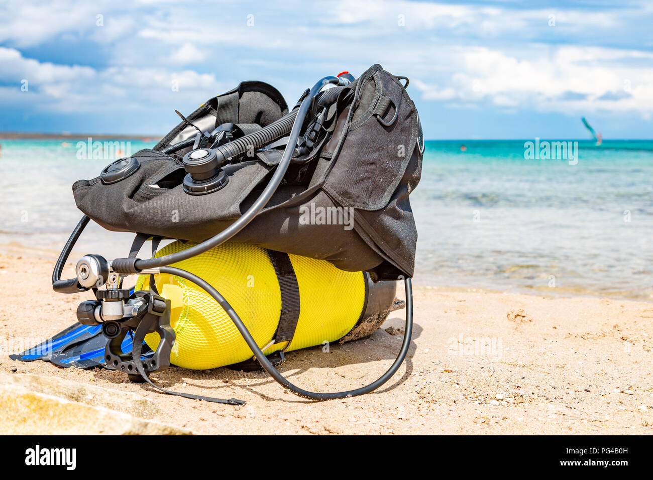 Equipment of a scuba diver, an oxygen balloon lies on the beach. Diving ...