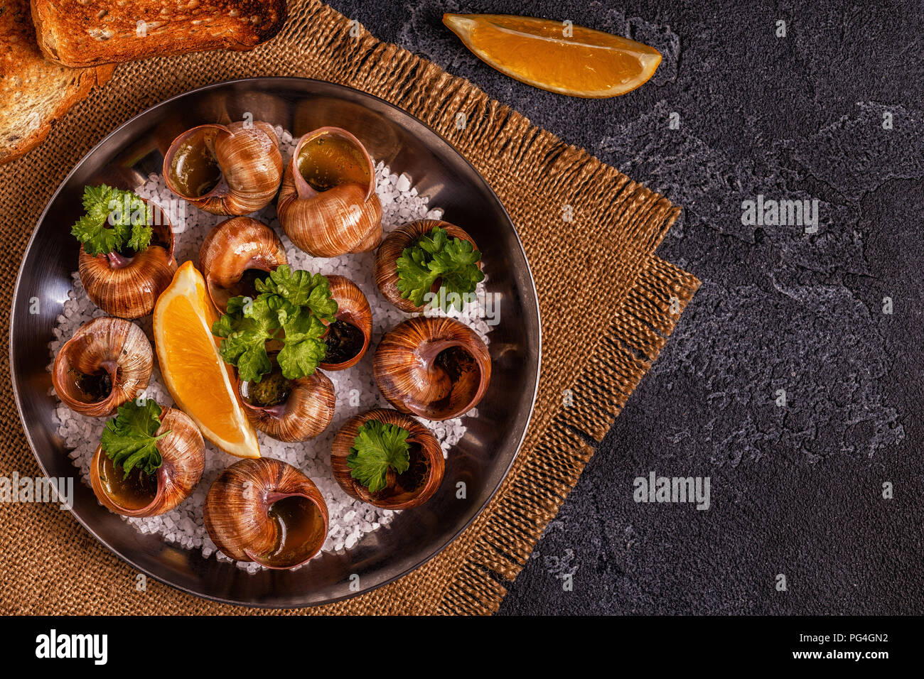 Snails with herb butter hi-res stock photography and images - Alamy