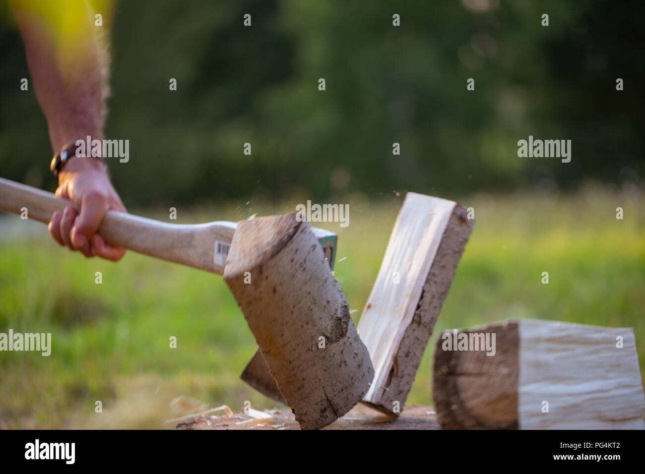 Lumberjack, chopping firewood on a fireblock. Life in countryside ...