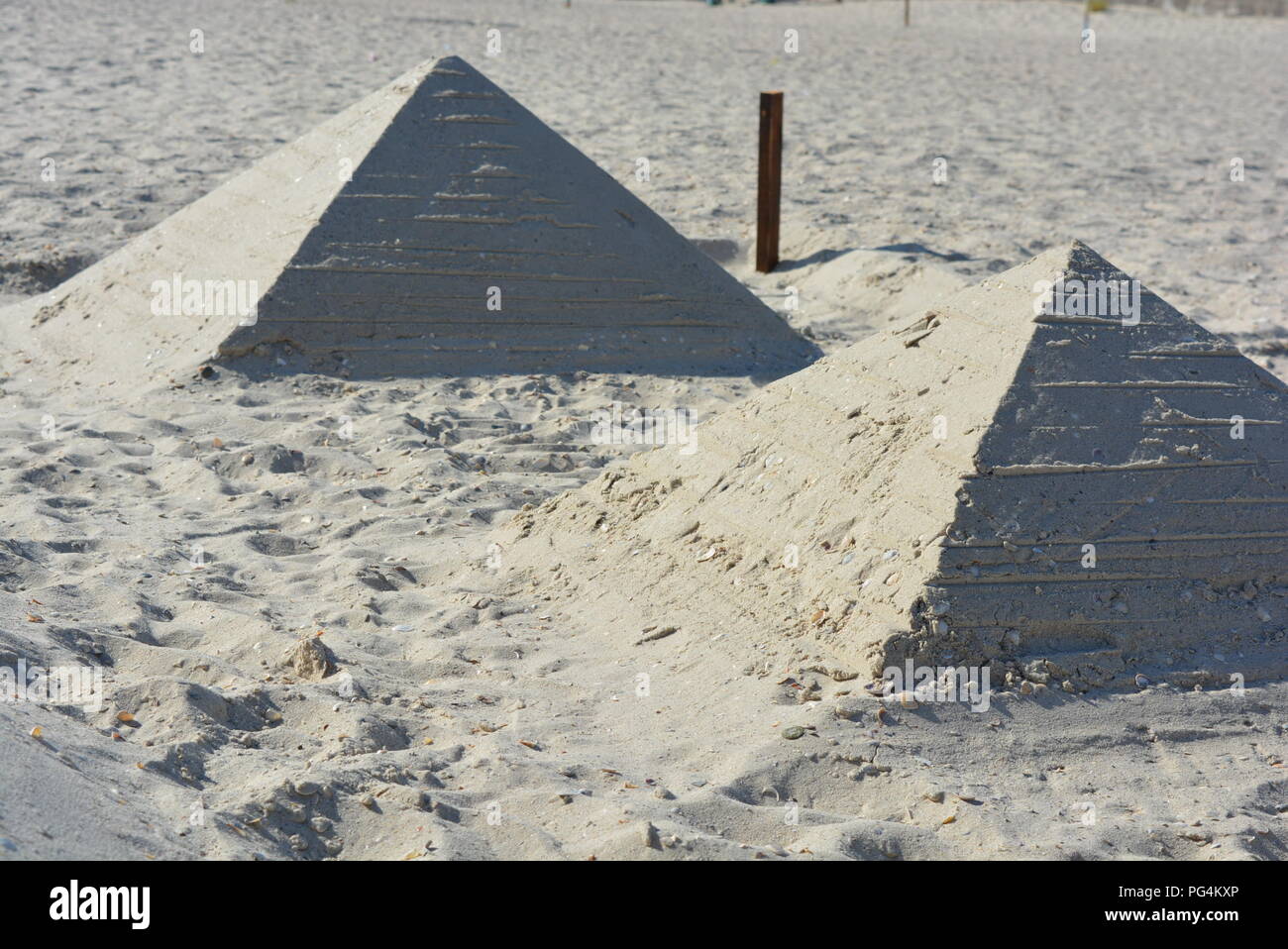 Made two pyramids of white sand and sea shells on the Black Sea beach ...