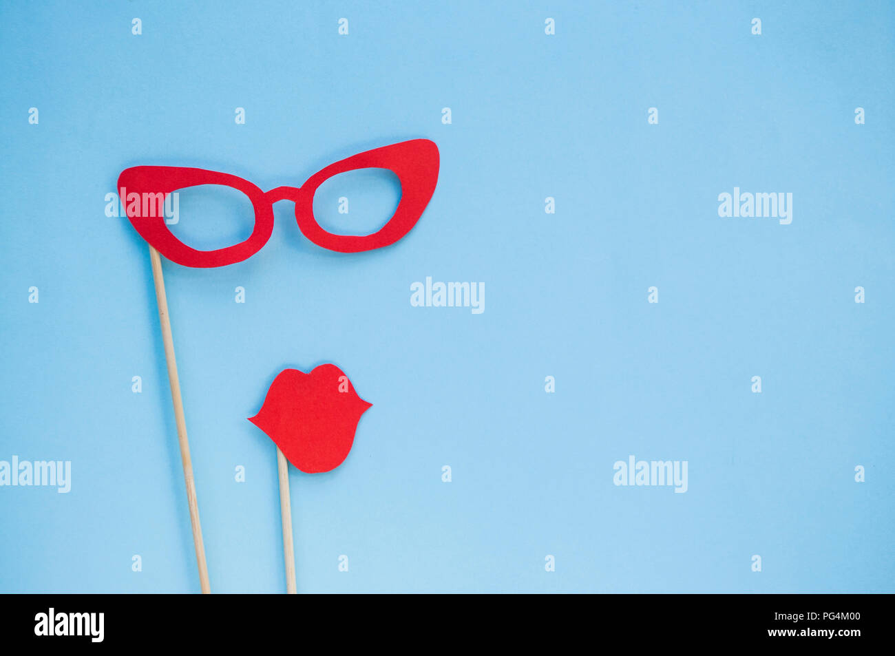Red bright photo booth props glasses and lips on blue background with ...