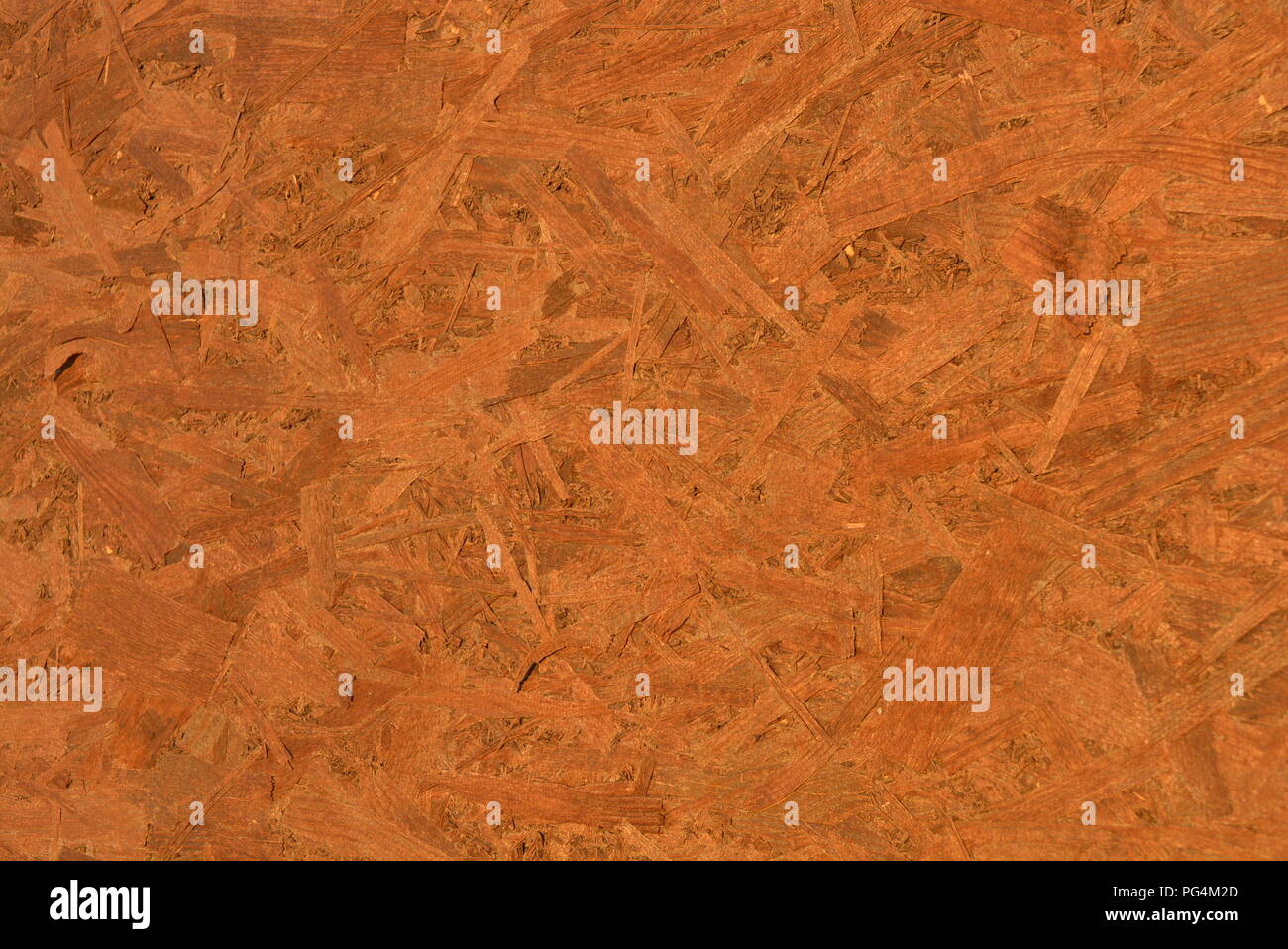 Construction oriented chipboard covered with brown varnish, original ...