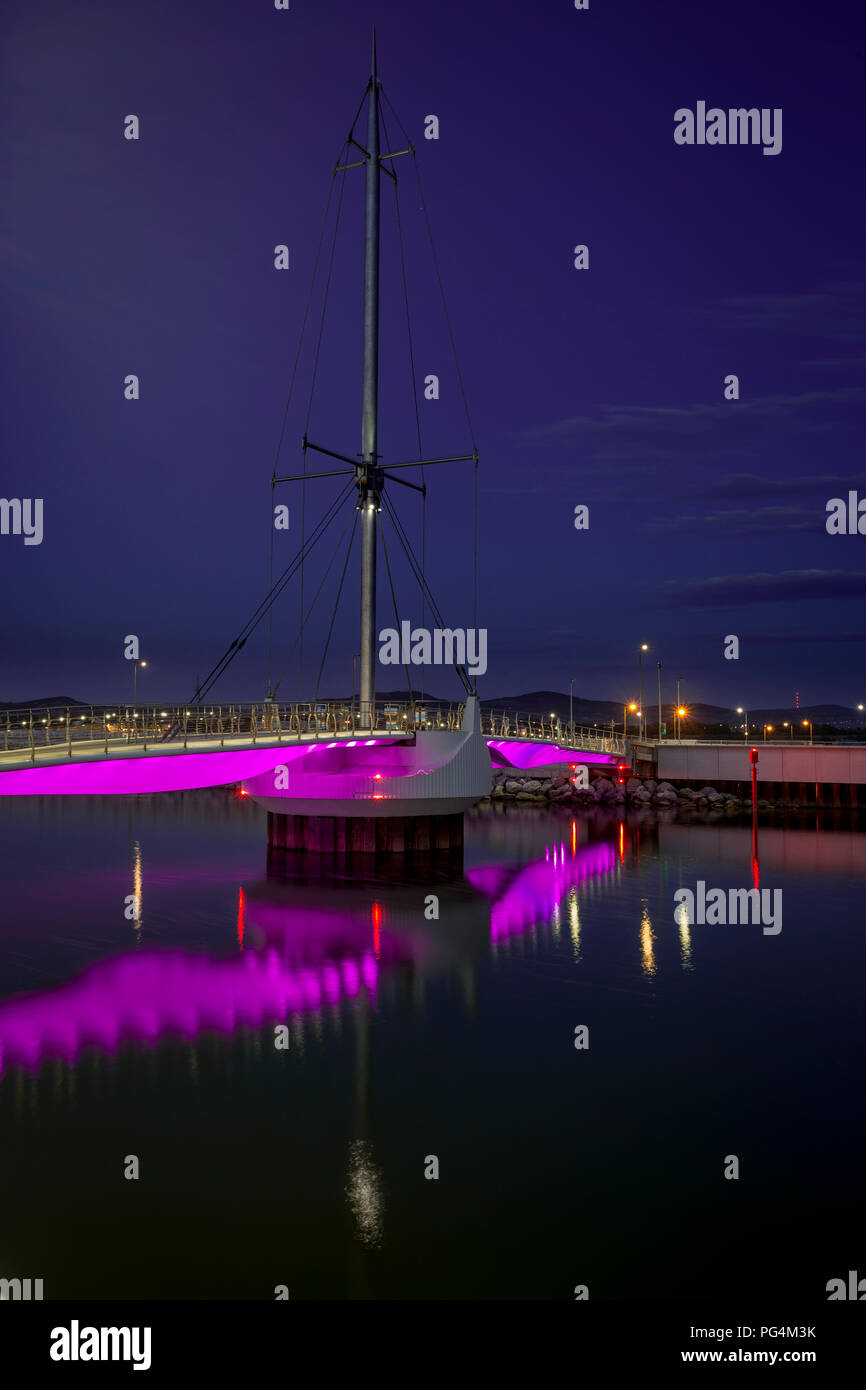 Pont y Ddraig footbridge at dusk, Rhyl harbour, on the North Wales ...