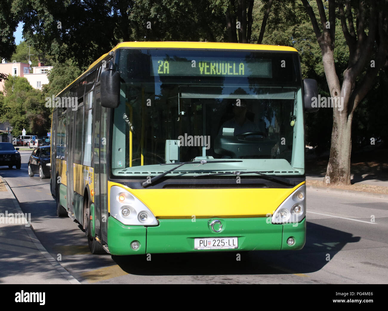 Single deck bus in green and yellow livery operated by Pulapromet on a ...