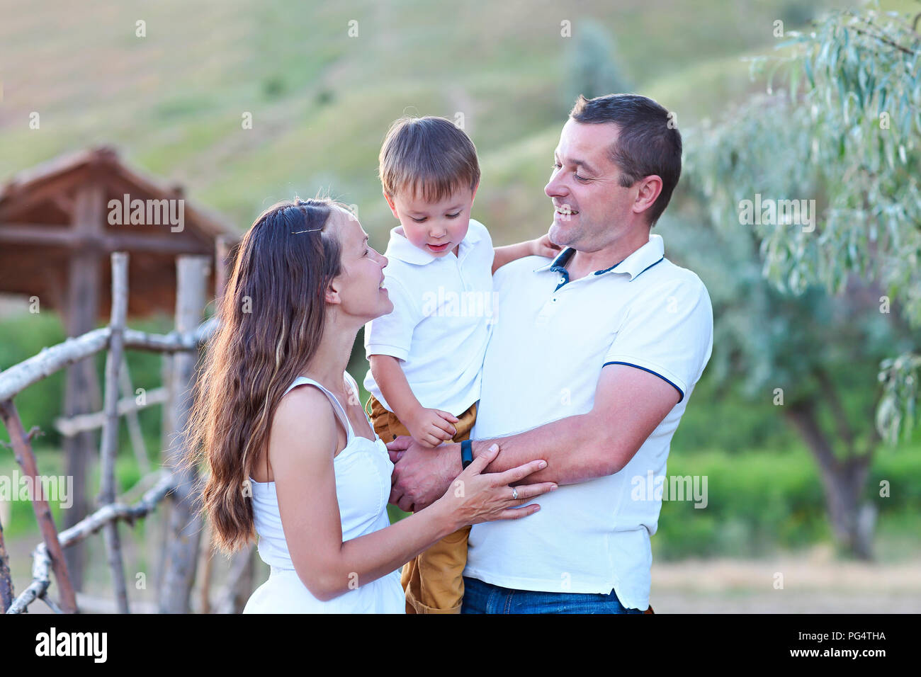 Happy family with little son having fun outdoors Stock Photo - Alamy