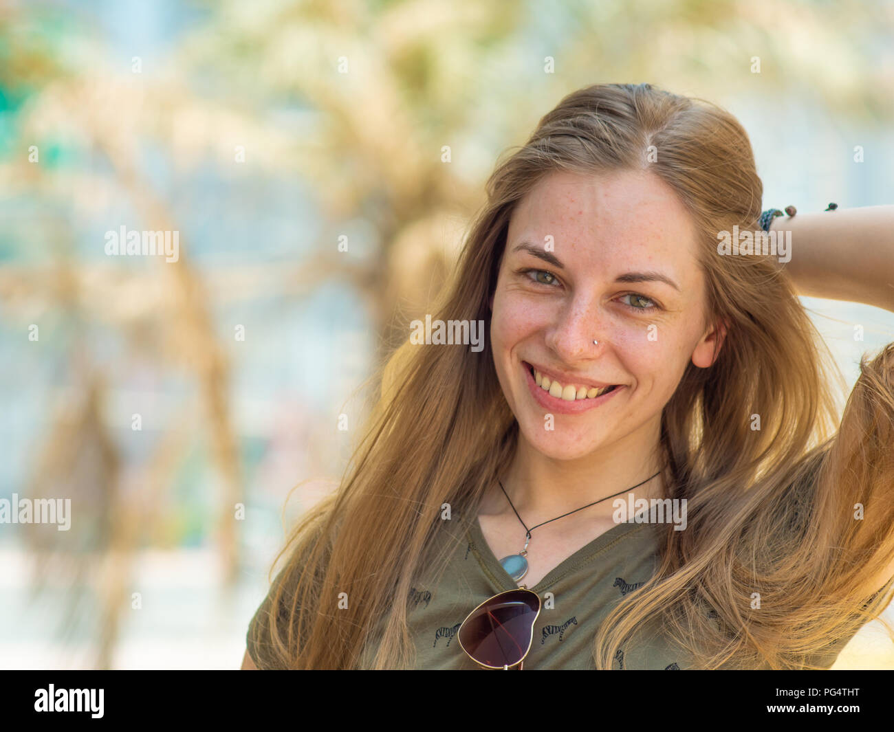 Portrait of a young and smiling girl in summer Stock Photo - Alamy