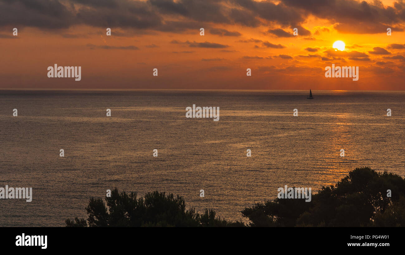 Balearic sea sunset sailing ship hi-res stock photography and images ...