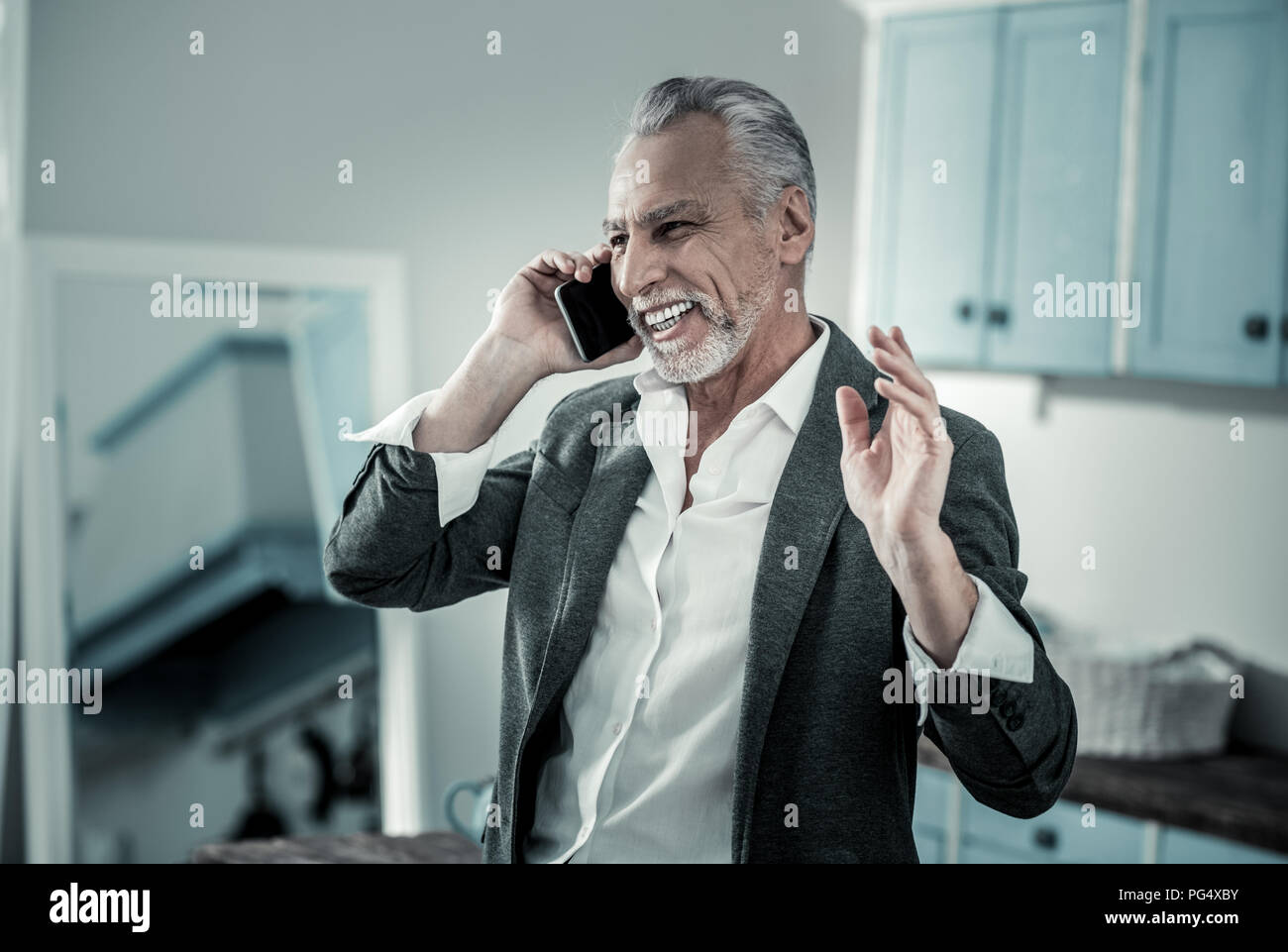Joyful male laughing at funny joke Stock Photo - Alamy