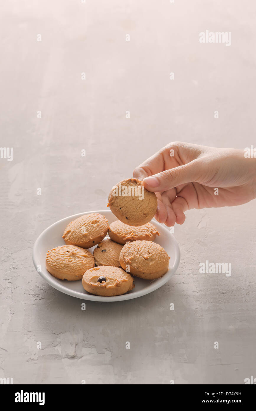 Hand picking cookie hi-res stock photography and images - Alamy