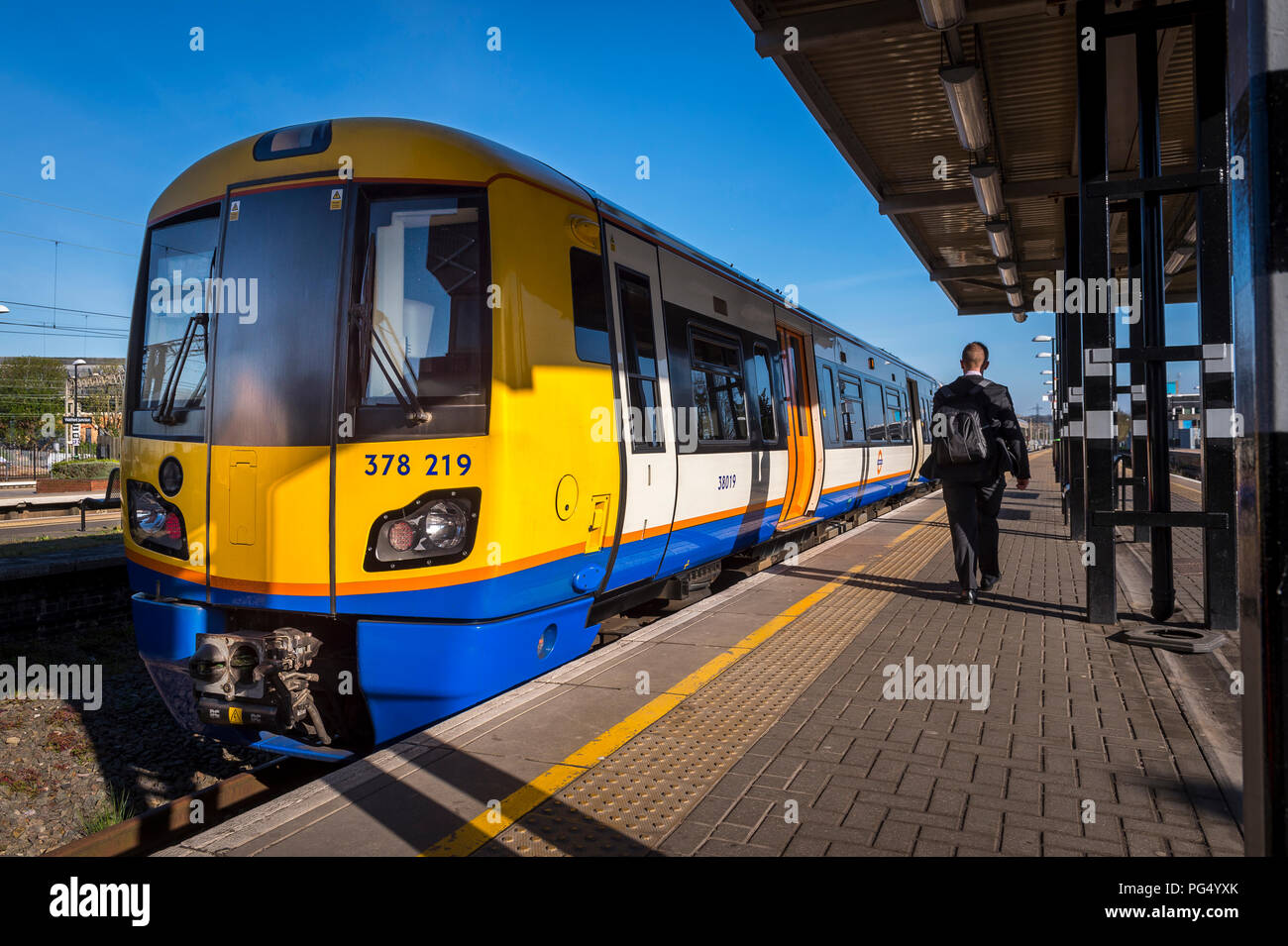 Class 378 passenger train in London Overground livery waiting at a ...