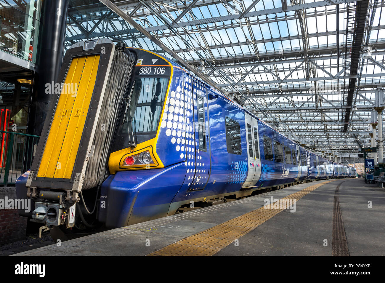 ScotRail Class 380 Desiro passenger train waiting at a station in the ...