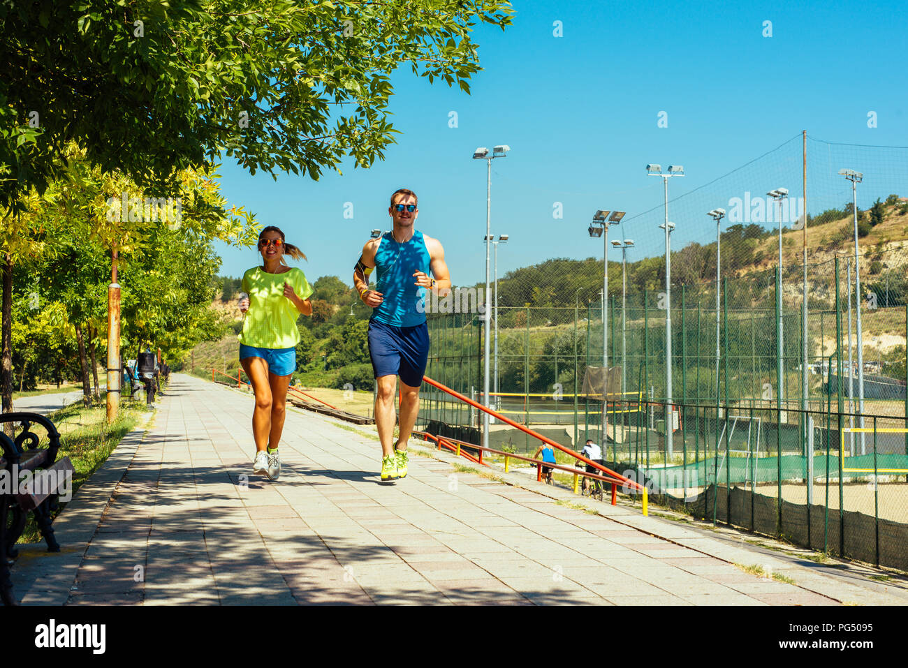 Young man running at riverside hi-res stock photography and images - Alamy