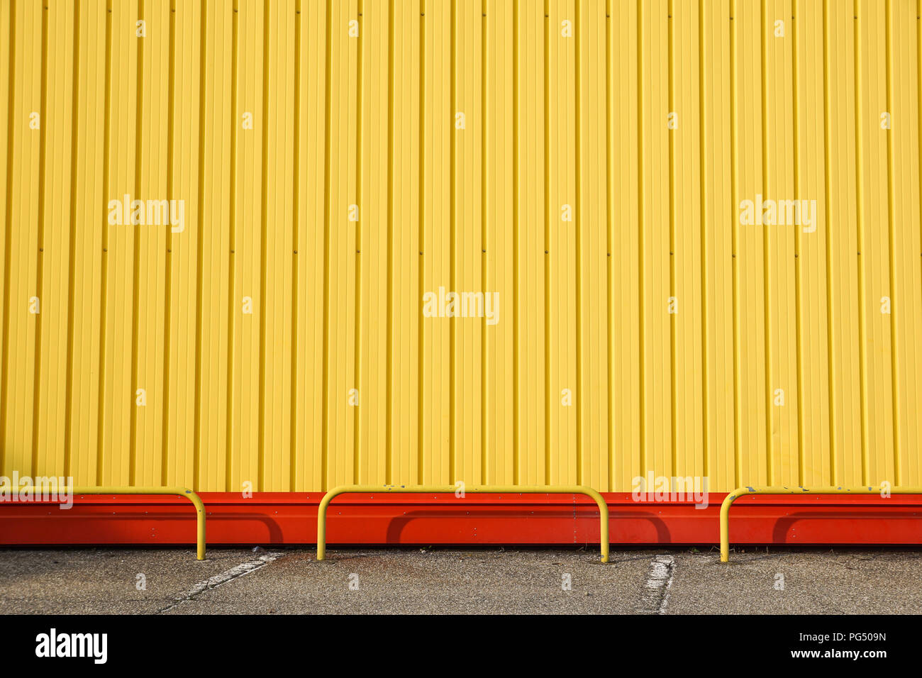 Detail of bright yellow metal building facade. For background Stock ...