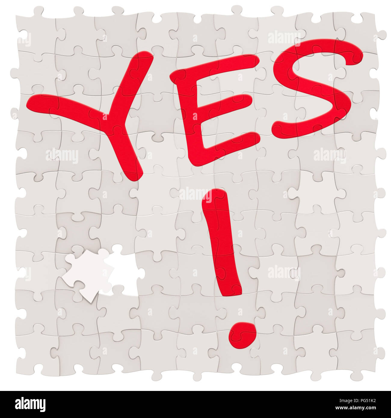 Cardboard jigsaw puzzles with red text "yes" assembled on white ...