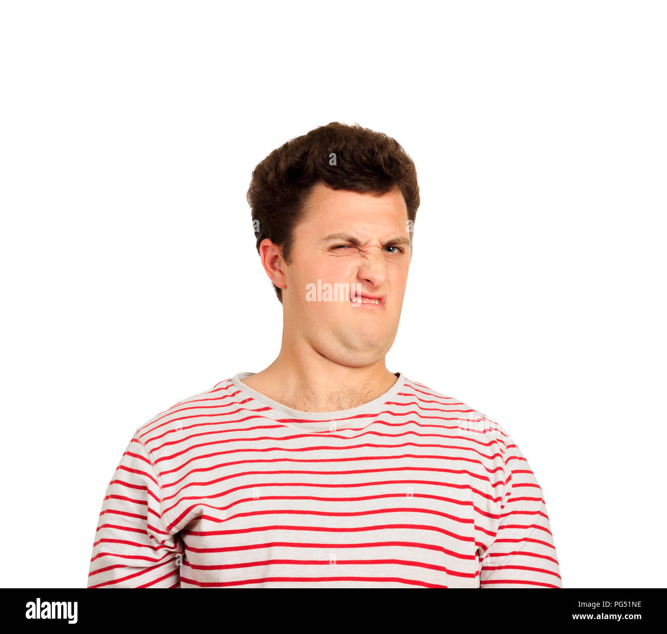 Disguting Shocked young man looking at something unpleasant and bad ...