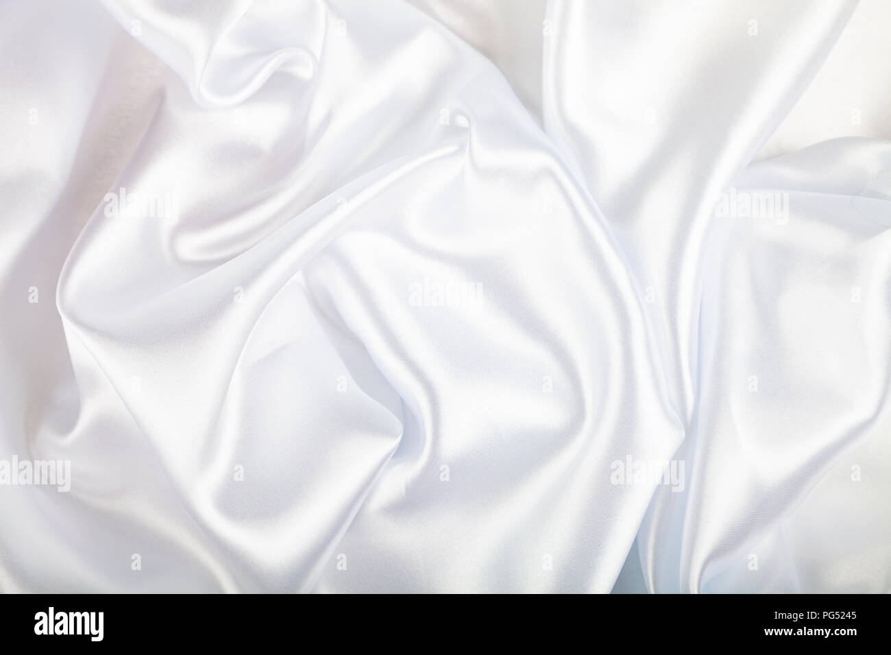 White silk fabric with folds. Beautiful background Stock Photo - Alamy