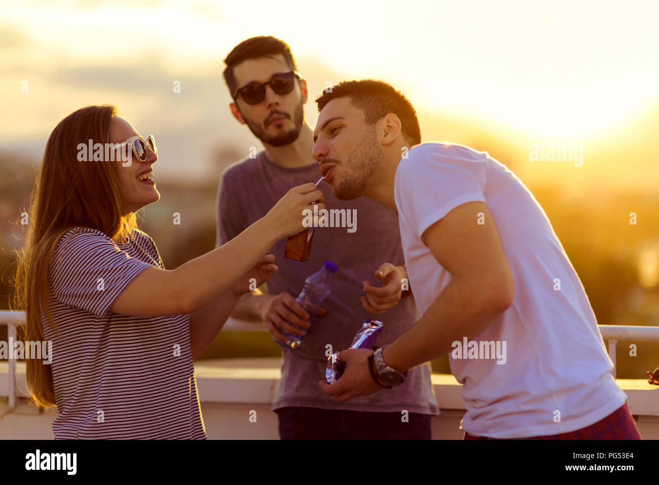 Three friends relaxing sunset hi-res stock photography and images - Alamy