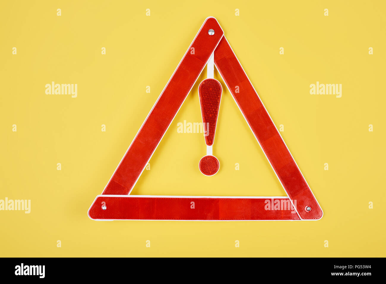 top view of warning triangle road sign isolated on yellow Stock Photo ...