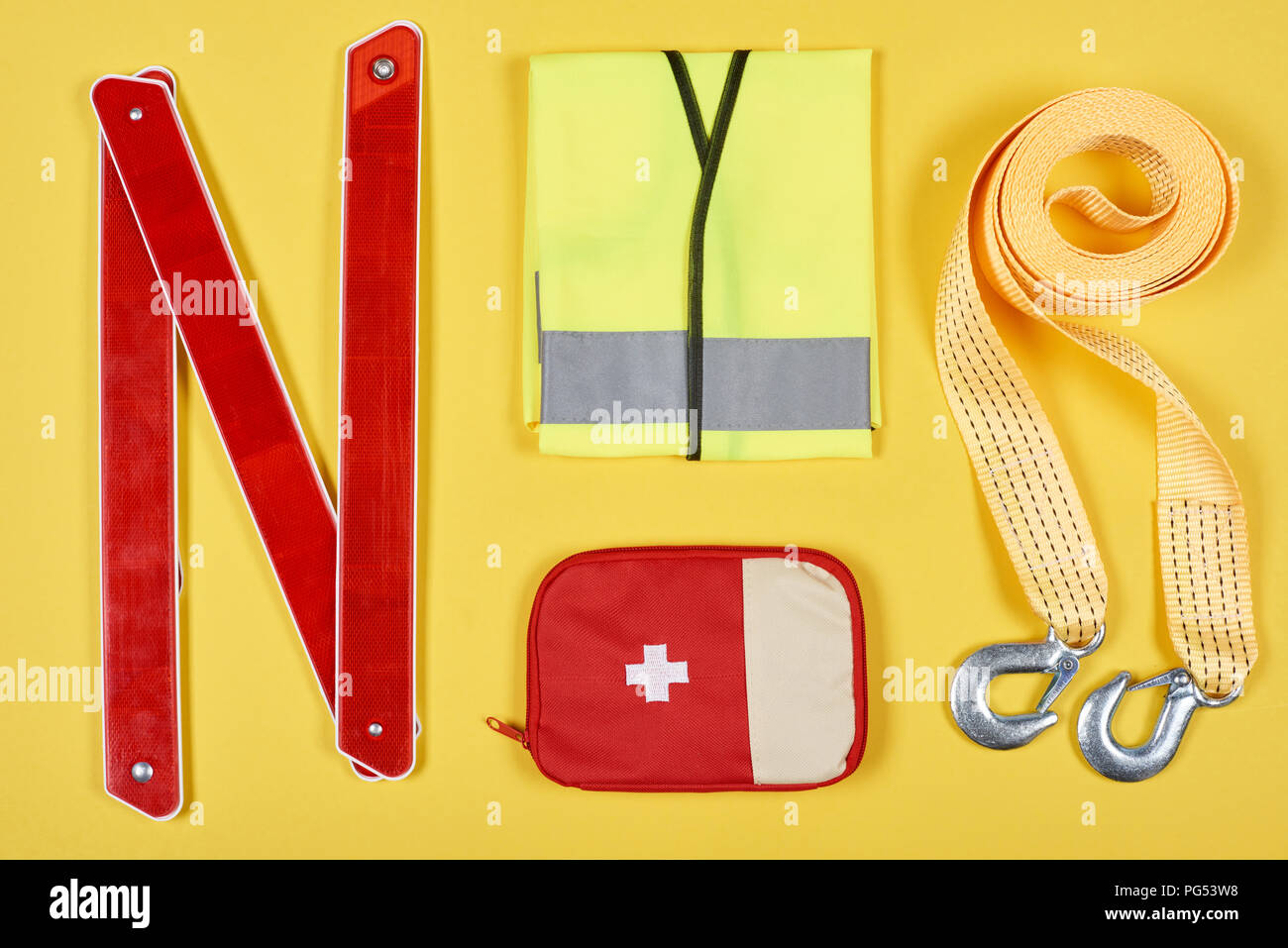 flat lay with arranged first aid kit and automotive accessories ...
