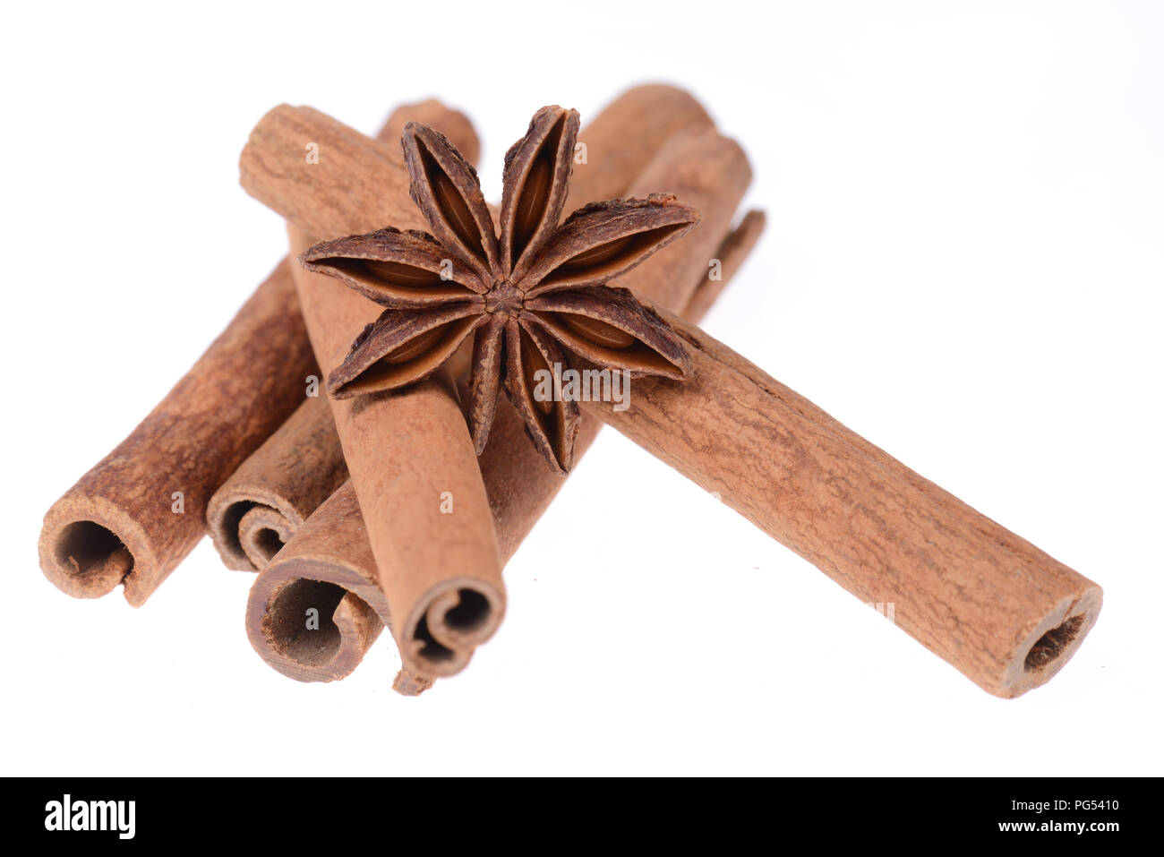 Aniseeds and cinnamon isolated on a white background Stock Photo - Alamy