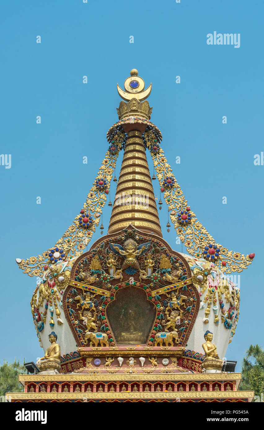 A Buddhist stupa on the background of blue sky in the Park Kopan ...