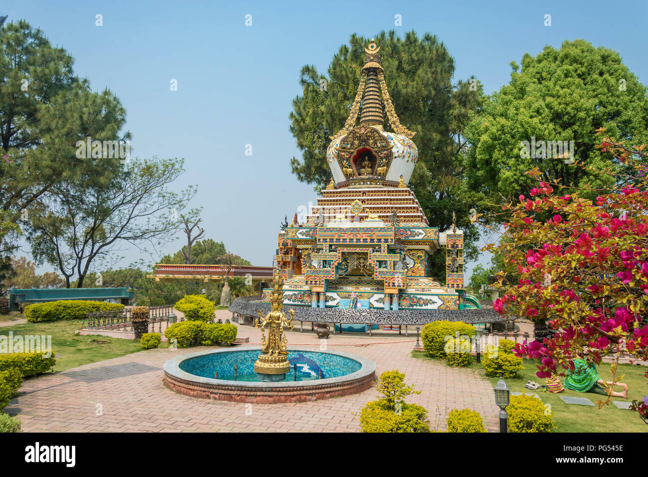 Stupa and the fountain in the Park of the Buddhist Kopan monastery ...