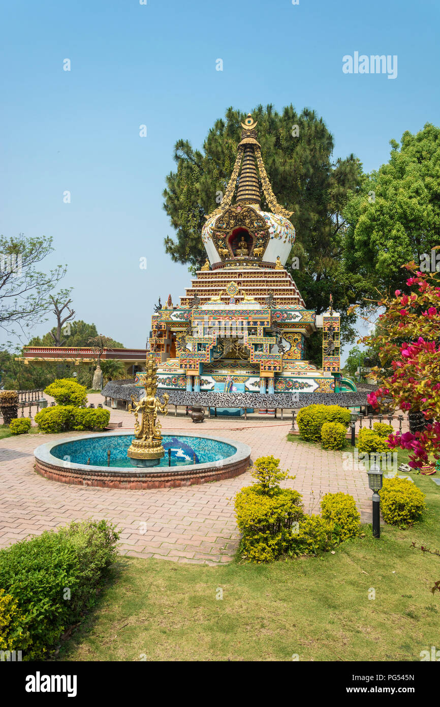 Stupa and the fountain in the Park of the Buddhist Kopan monastery ...
