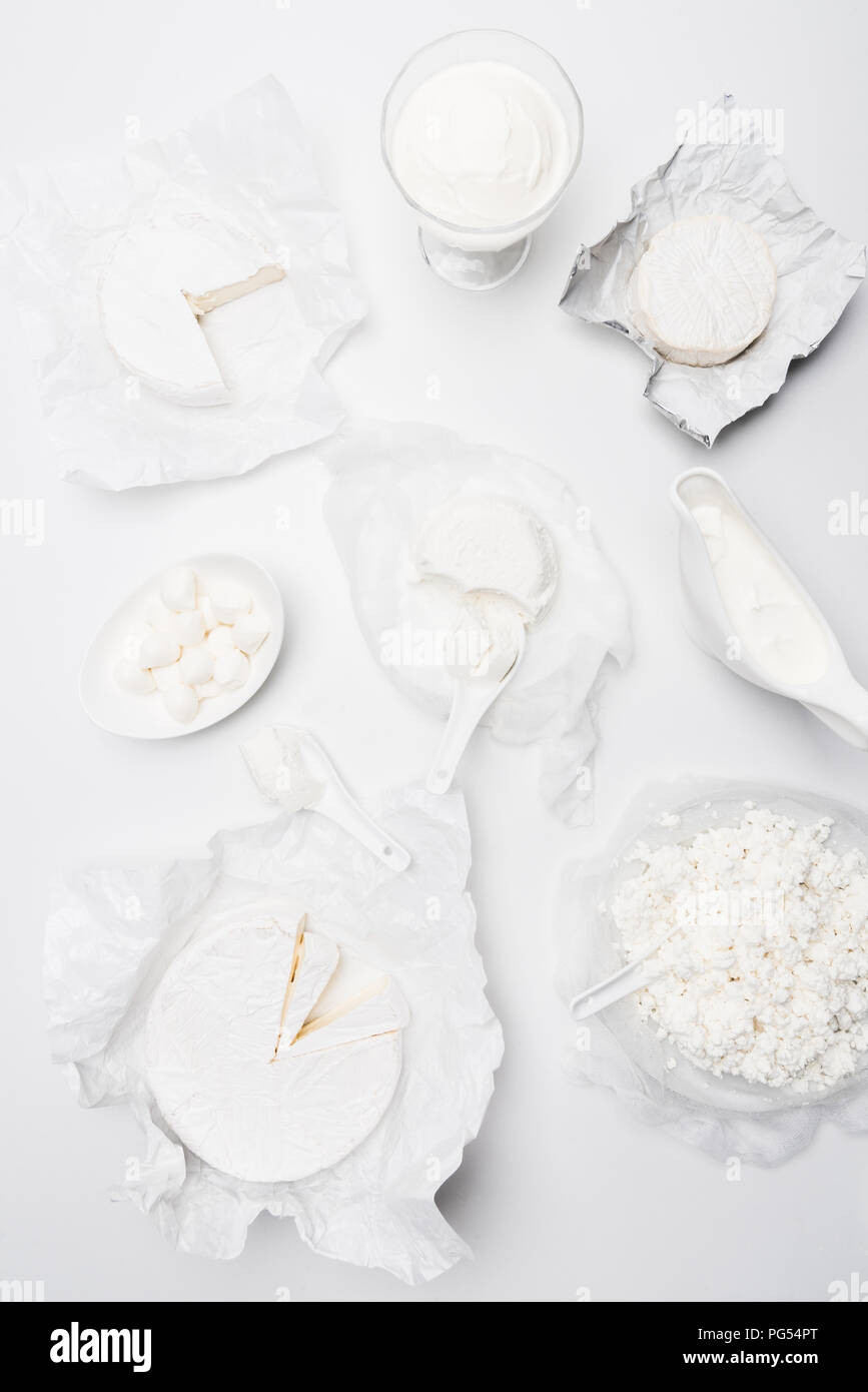 top view of different milk products on white surface Stock Photo - Alamy