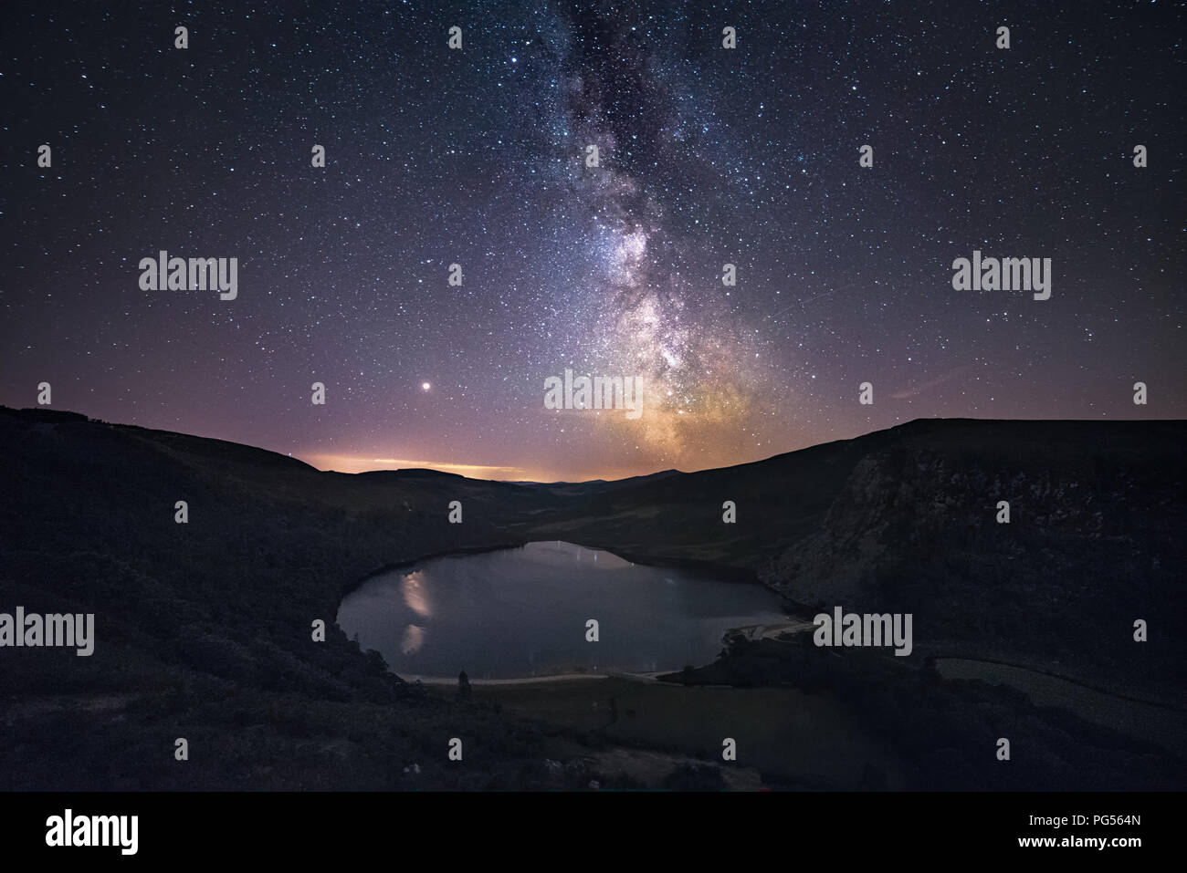 Ireland Landscape nihgt at Wicklow Mountains and Milky Way above Lough ...