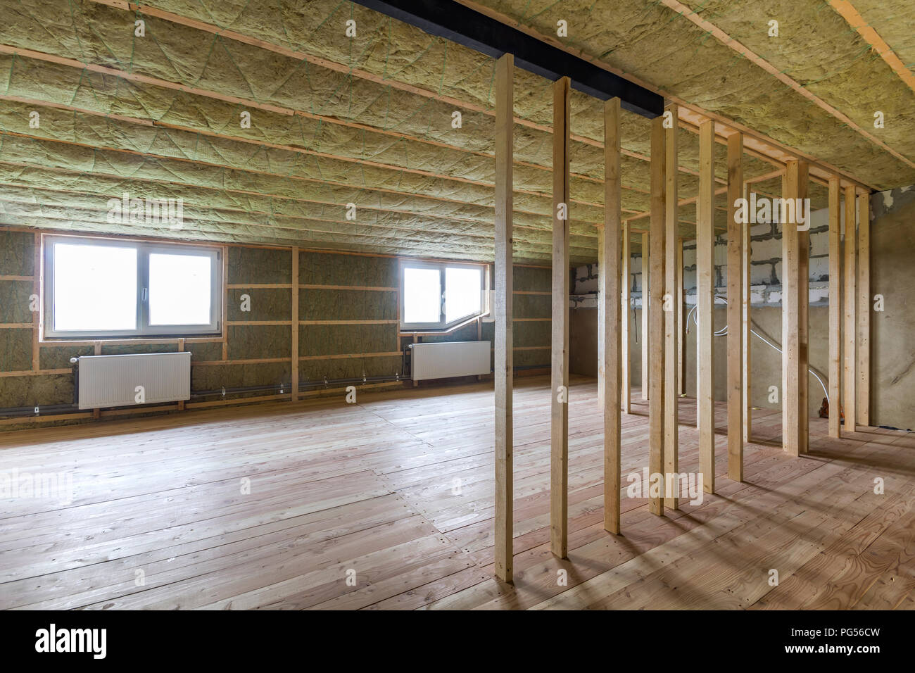Construction and renovation of big light spacious empty room with oak ...