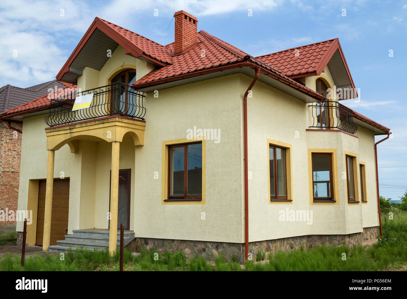 Two story yellow house porch hi-res stock photography and images - Alamy
