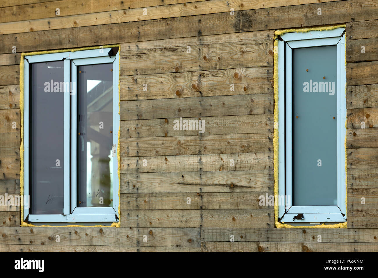 Close-up detail of new narrow plastic vinyl windows installed in house ...