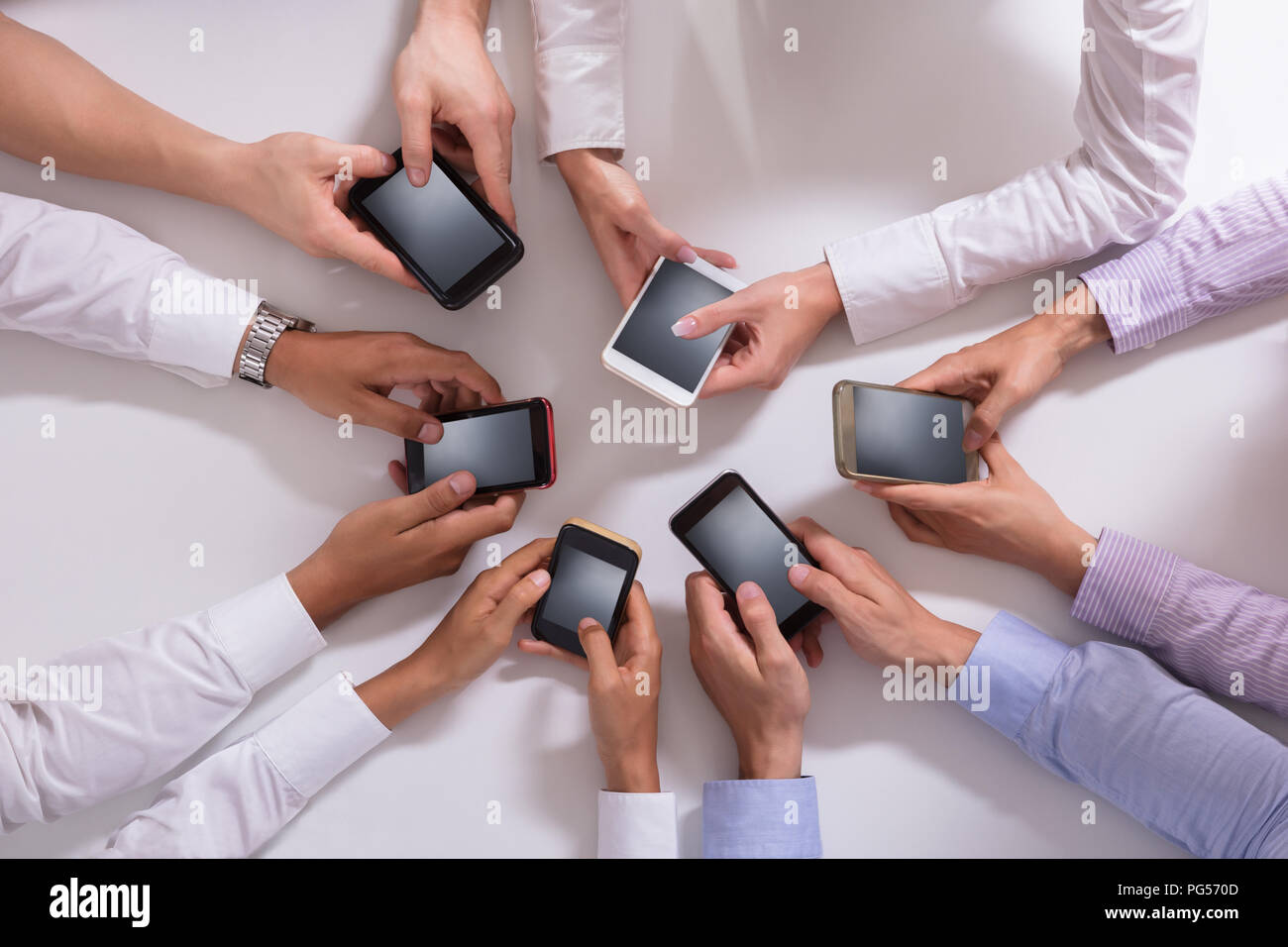 Large group of people and cell phones hi-res stock photography and ...