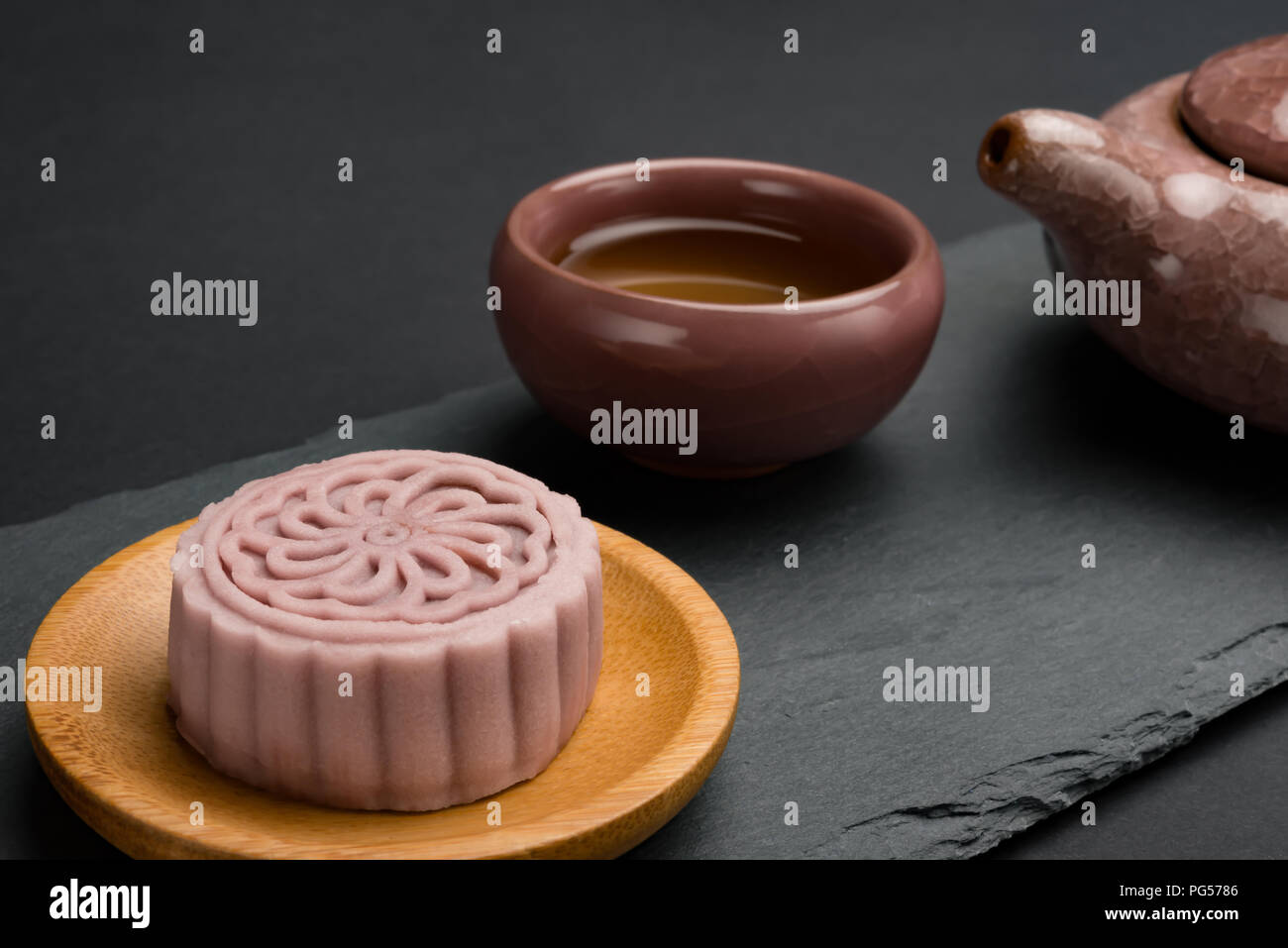 side view studio shoot of modern style Chinese mooncake with tea and ...