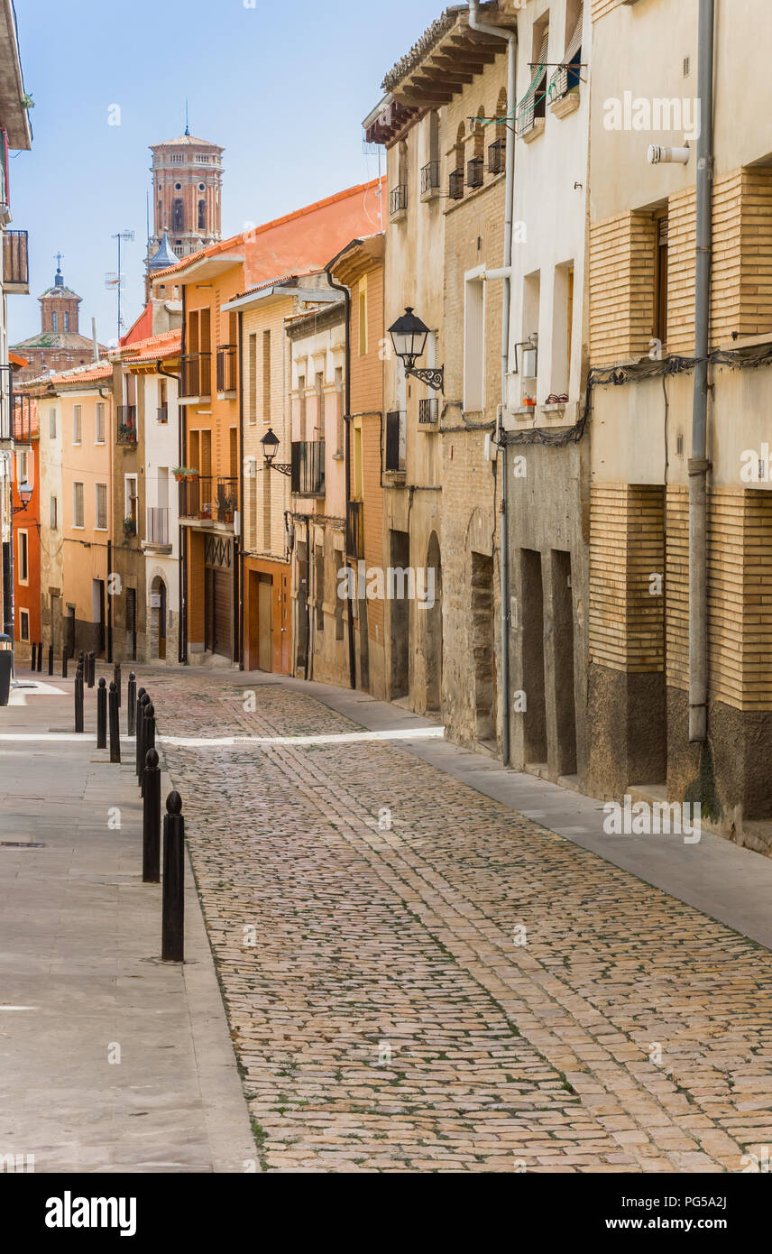 Street with colorful houses and cathedral tower in Tudela, Spain Stock ...