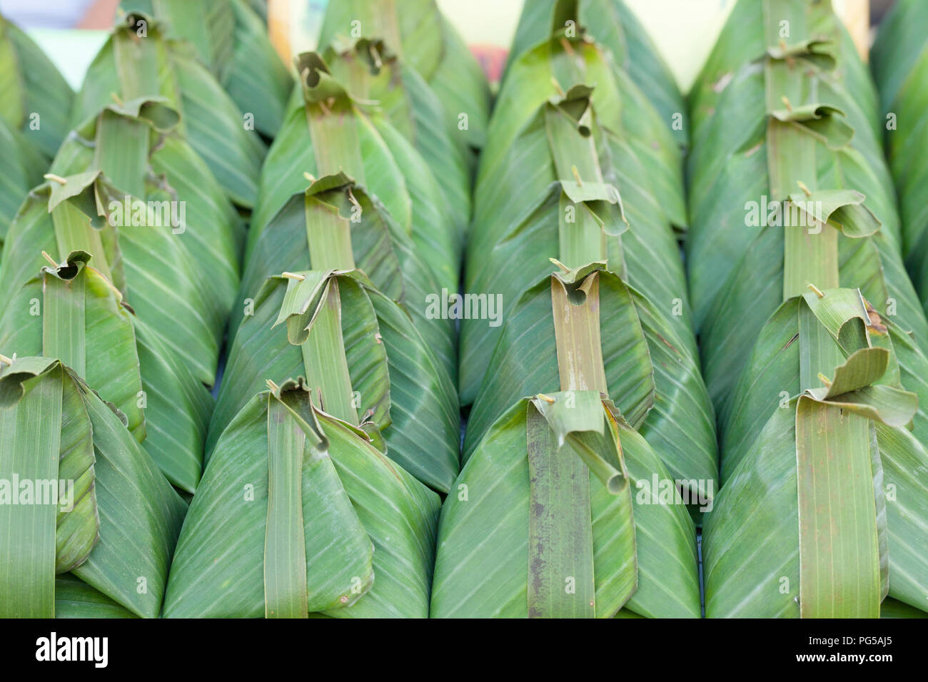 Khao tom mad, a Thai traditional dessert made from sticky rice, coconut ...