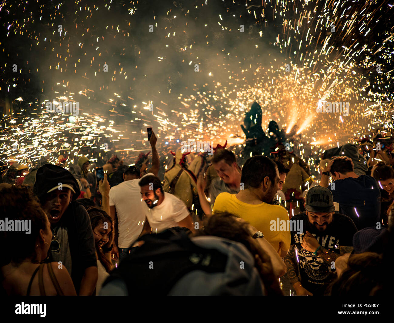 Barcelona, Spain. August 22, 2018 - People celebrating in the Fire Run ...