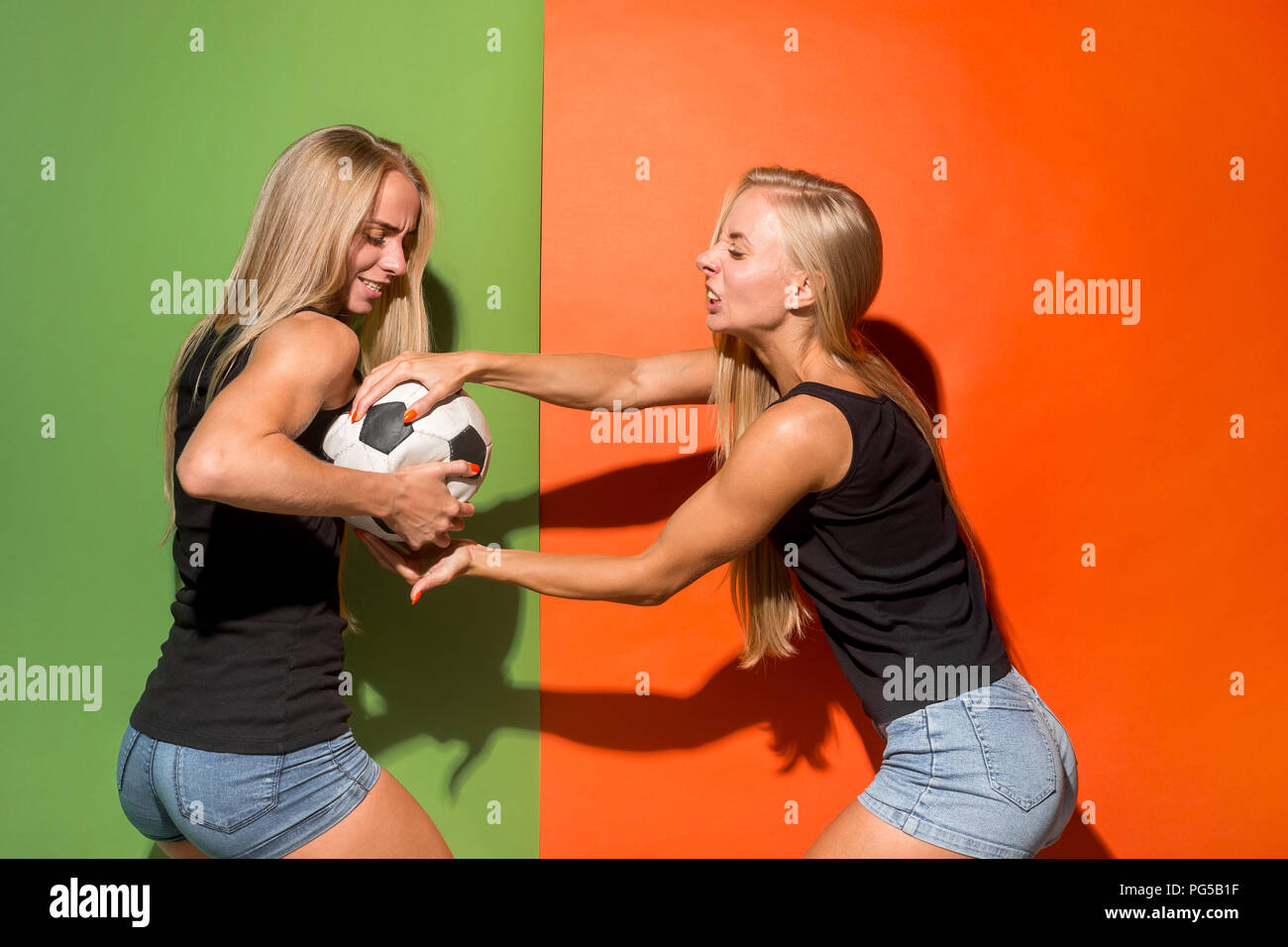 fight for the ball. Fan sport women player holding soccer ball and ...