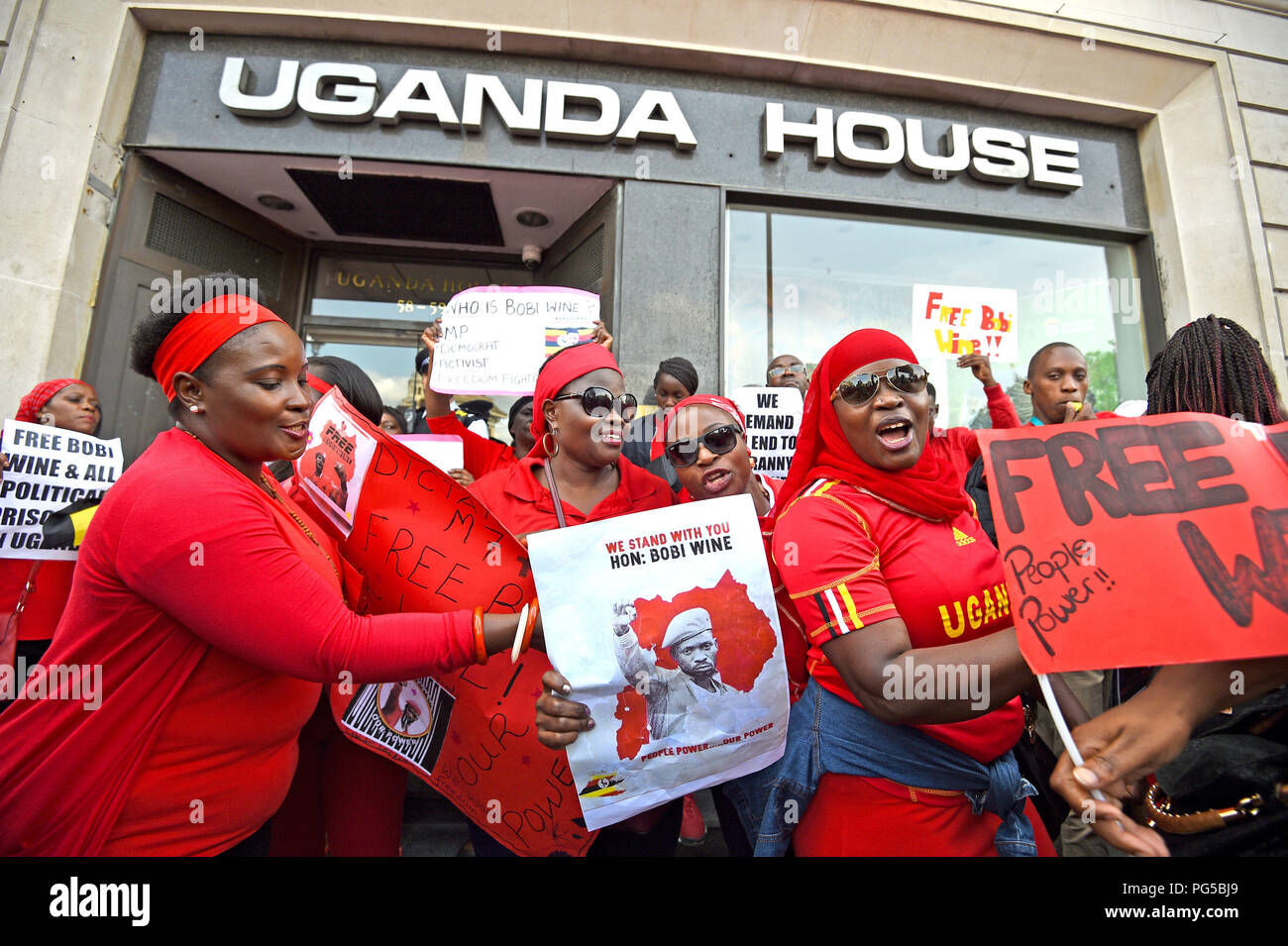 Ugandans protest outside Uganda House in Trafalgar Square, London ...