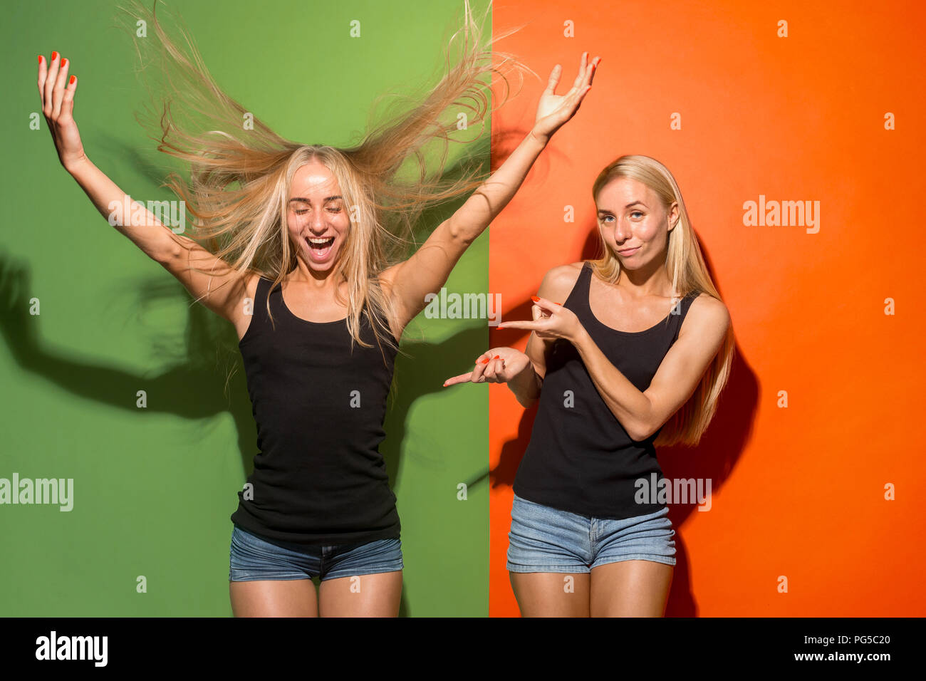 Happy women standing and smiling isolated on studio background ...