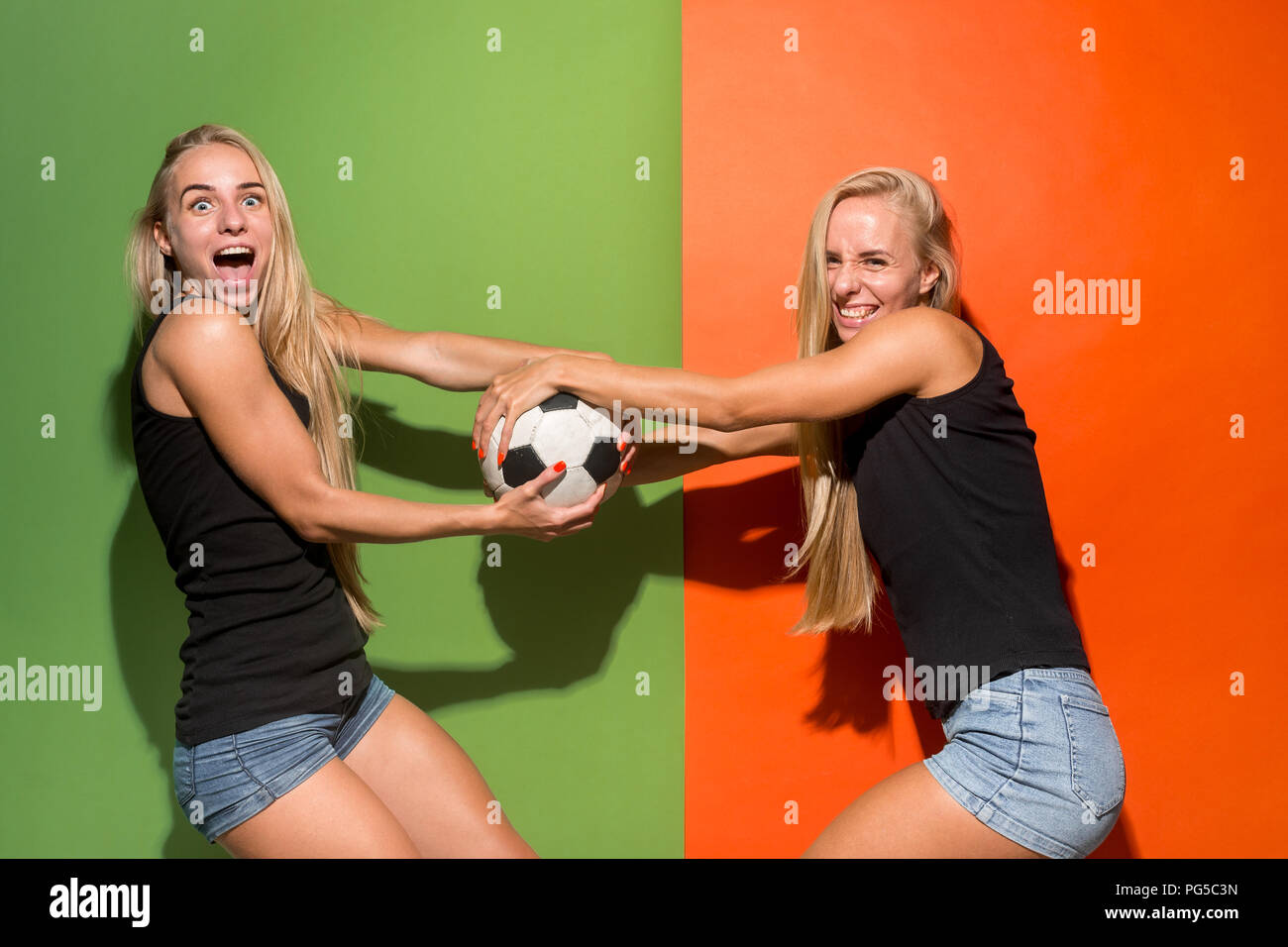 fight for the ball. Fan sport women player holding soccer ball and ...