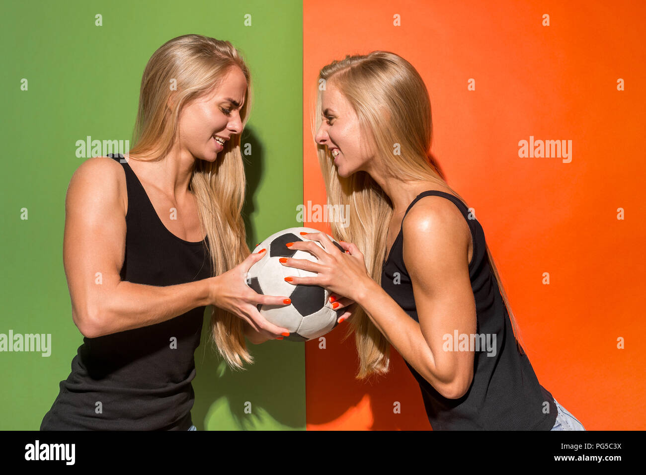 fight for the ball. Fan sport women player holding soccer ball and ...