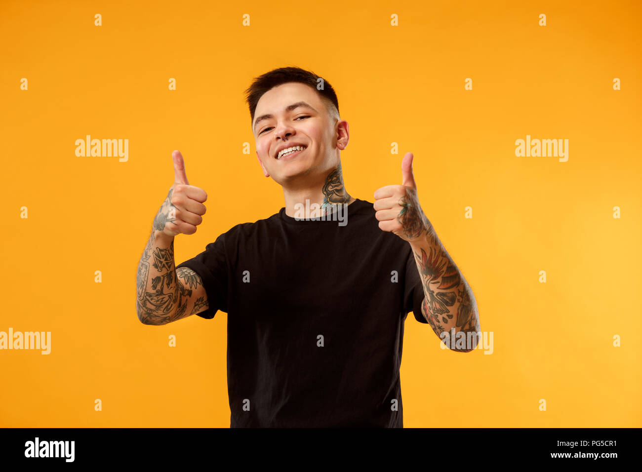 I am ok. Happy businessman, sign ok, smiling, isolated on trendy orange ...