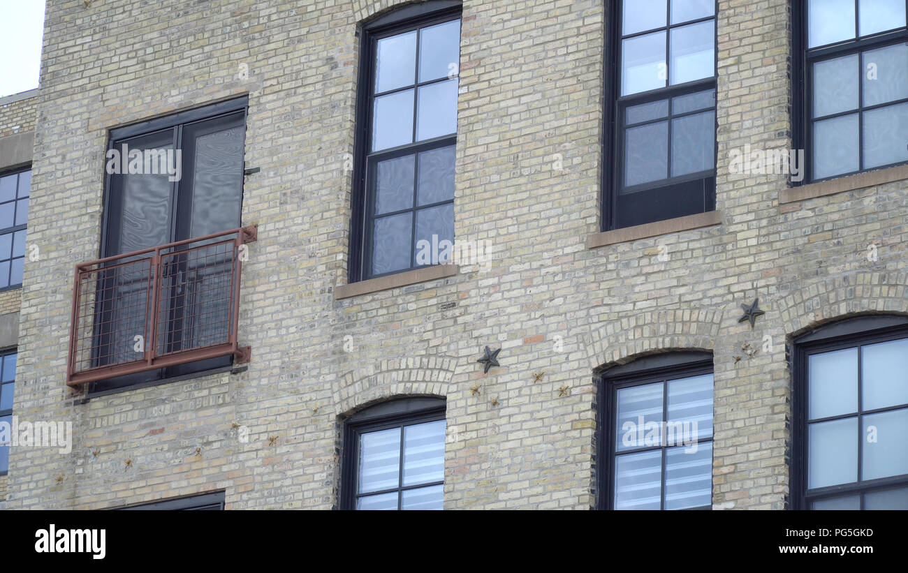 Urban city apartment building exterior establishing shot of brick ...