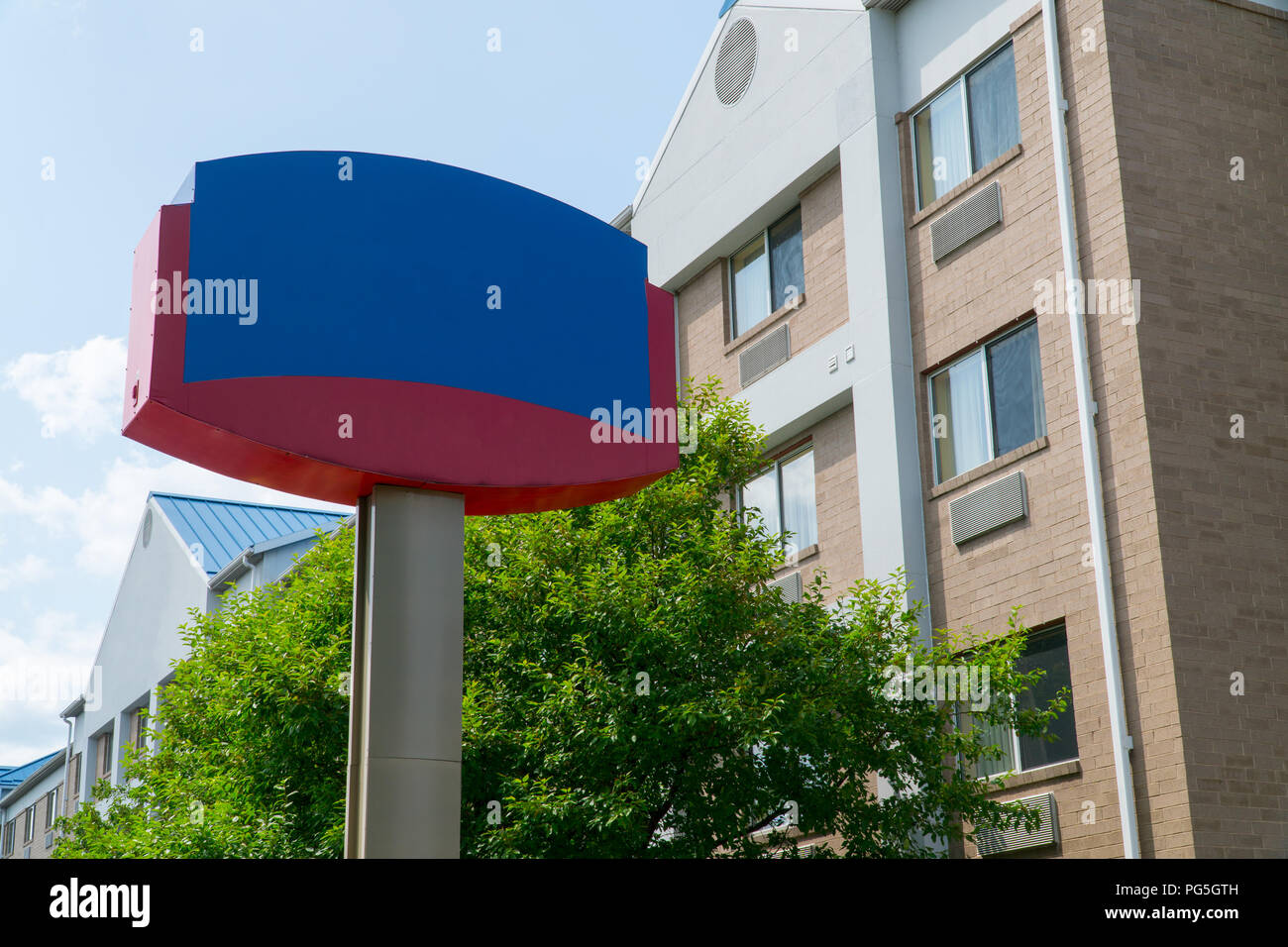 Blank hotel street sign exterior outside motel building facade for ...