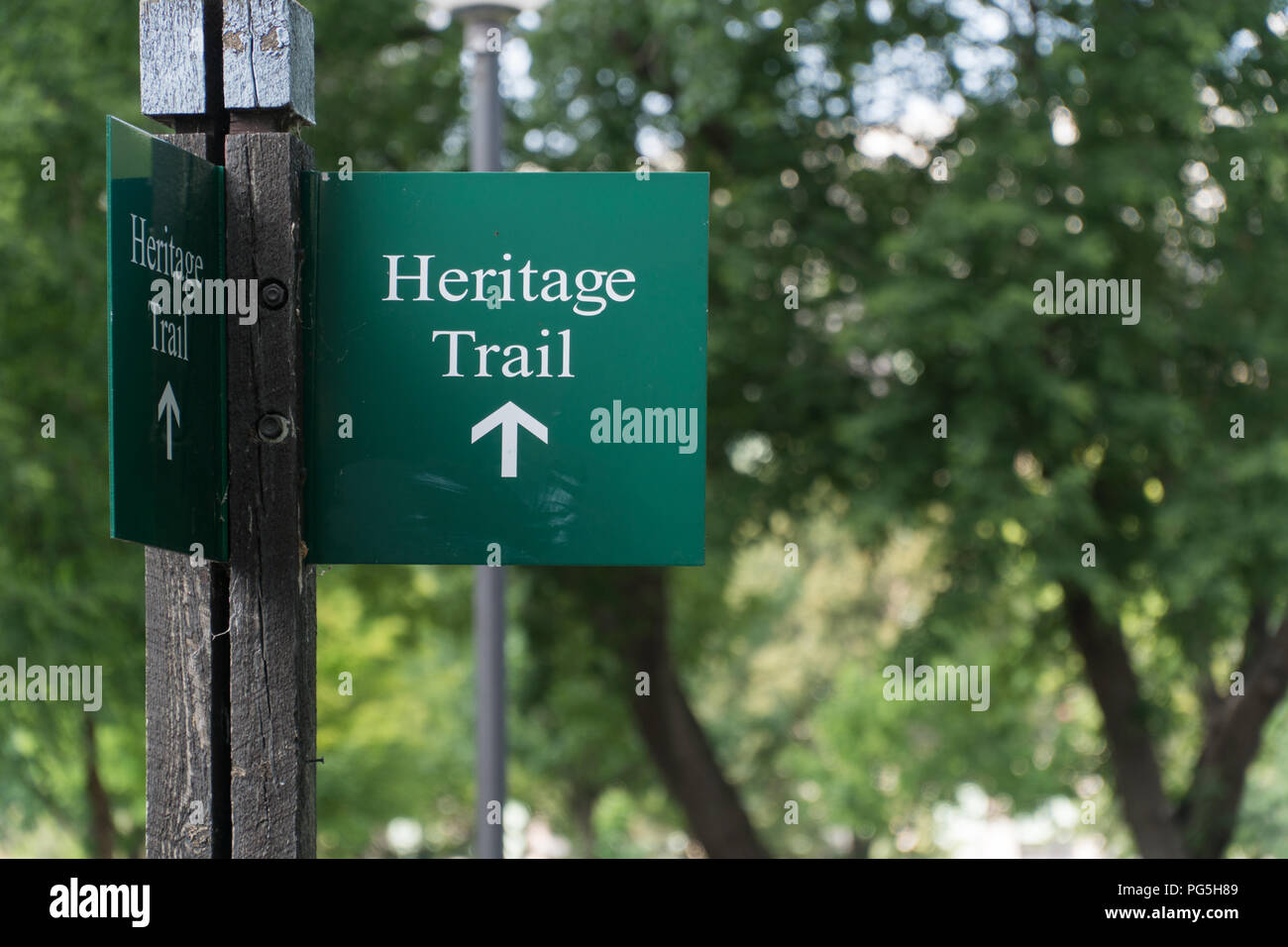 Heritage Trail sign on wood post marking symbol for nature hike walk ...