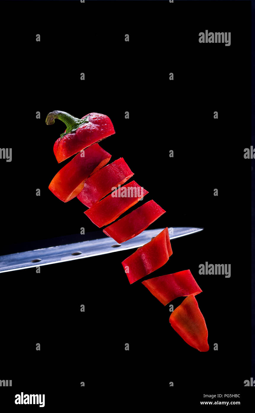 Red sweet bell pepper slices isolated on black background cutout Stock ...